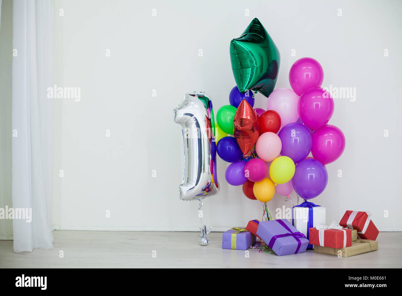 multi-colored balloons and gifts for the holiday Stock Photo - Alamy
