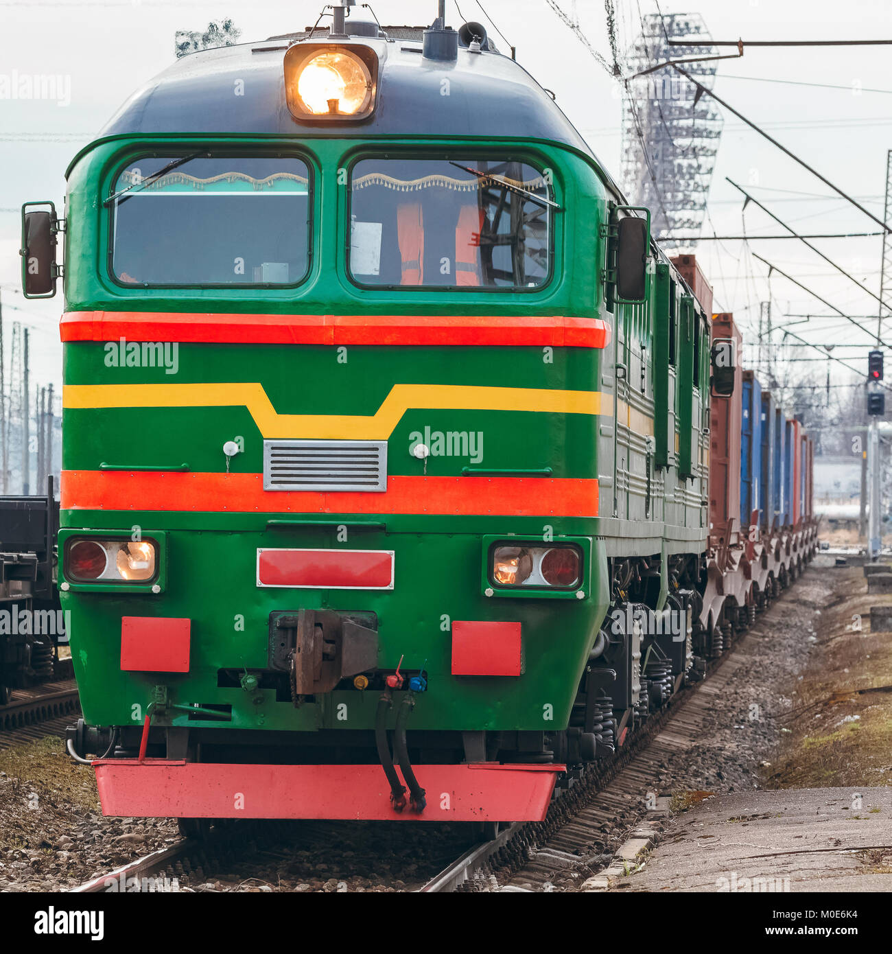 Green diesel cargo locomotive. Freight train in action Stock Photo - Alamy