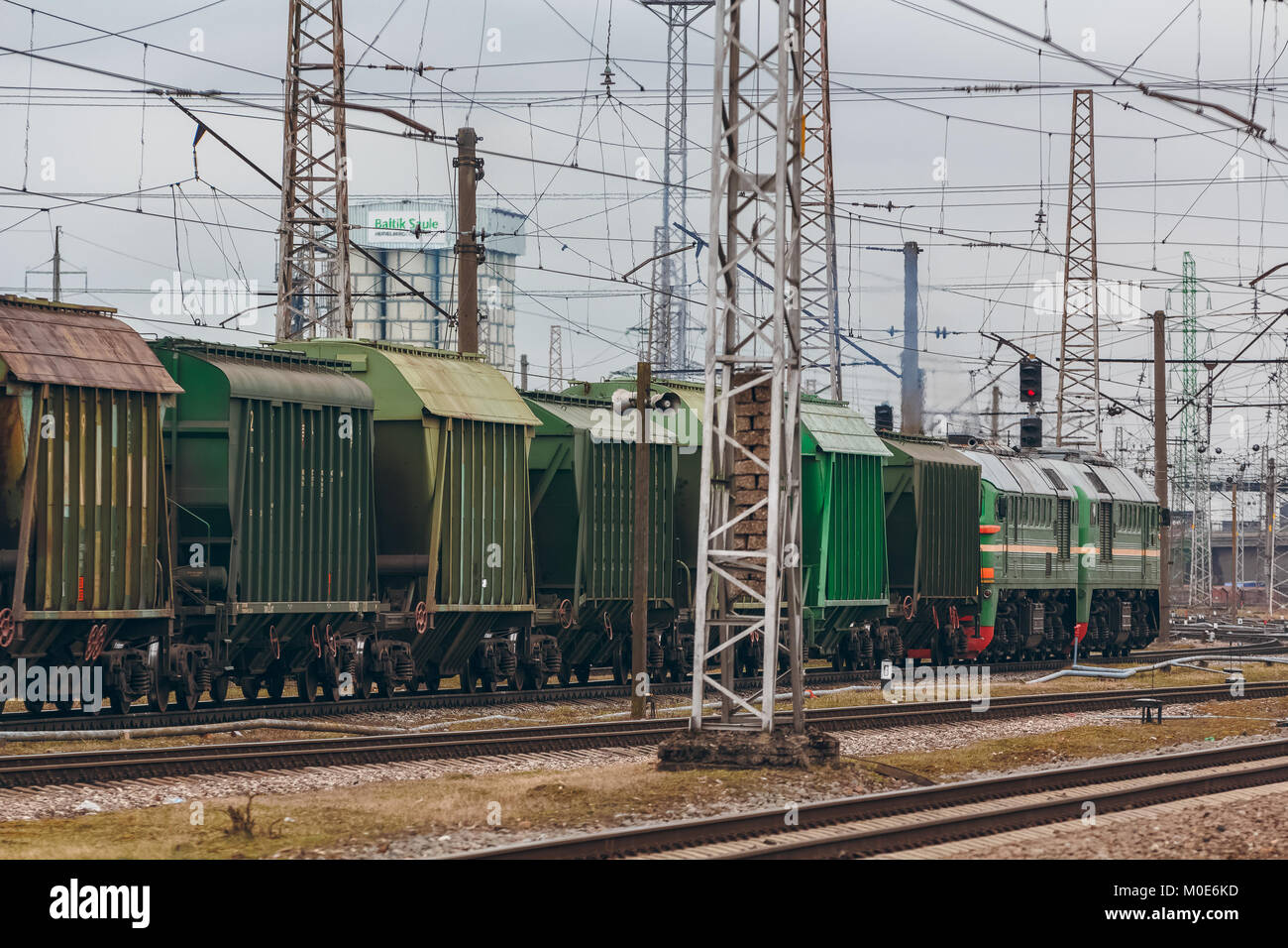 Green diesel cargo locomotive. Freight train in action Stock Photo - Alamy
