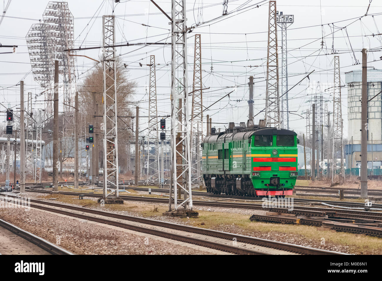 Green diesel cargo locomotive. Freight train in action Stock Photo - Alamy