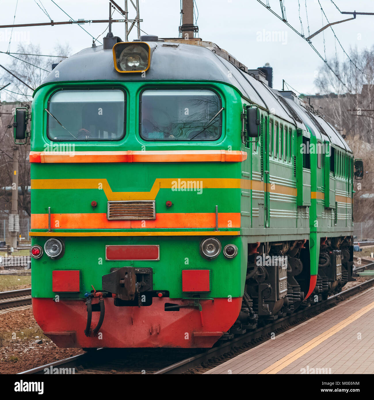 Green diesel cargo locomotive. Freight train in action Stock Photo - Alamy