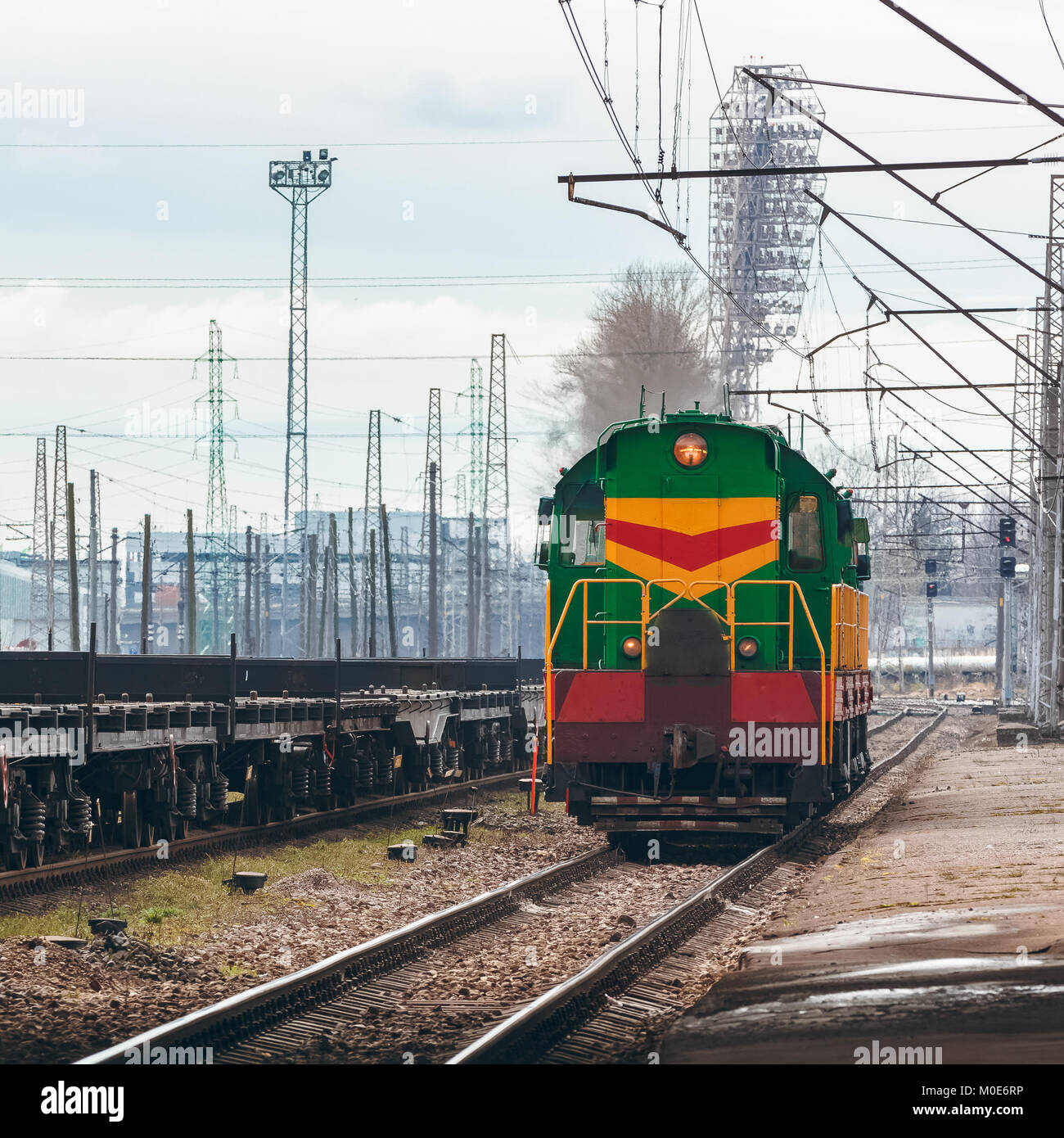 Green diesel cargo locomotive. Freight train in action Stock Photo - Alamy