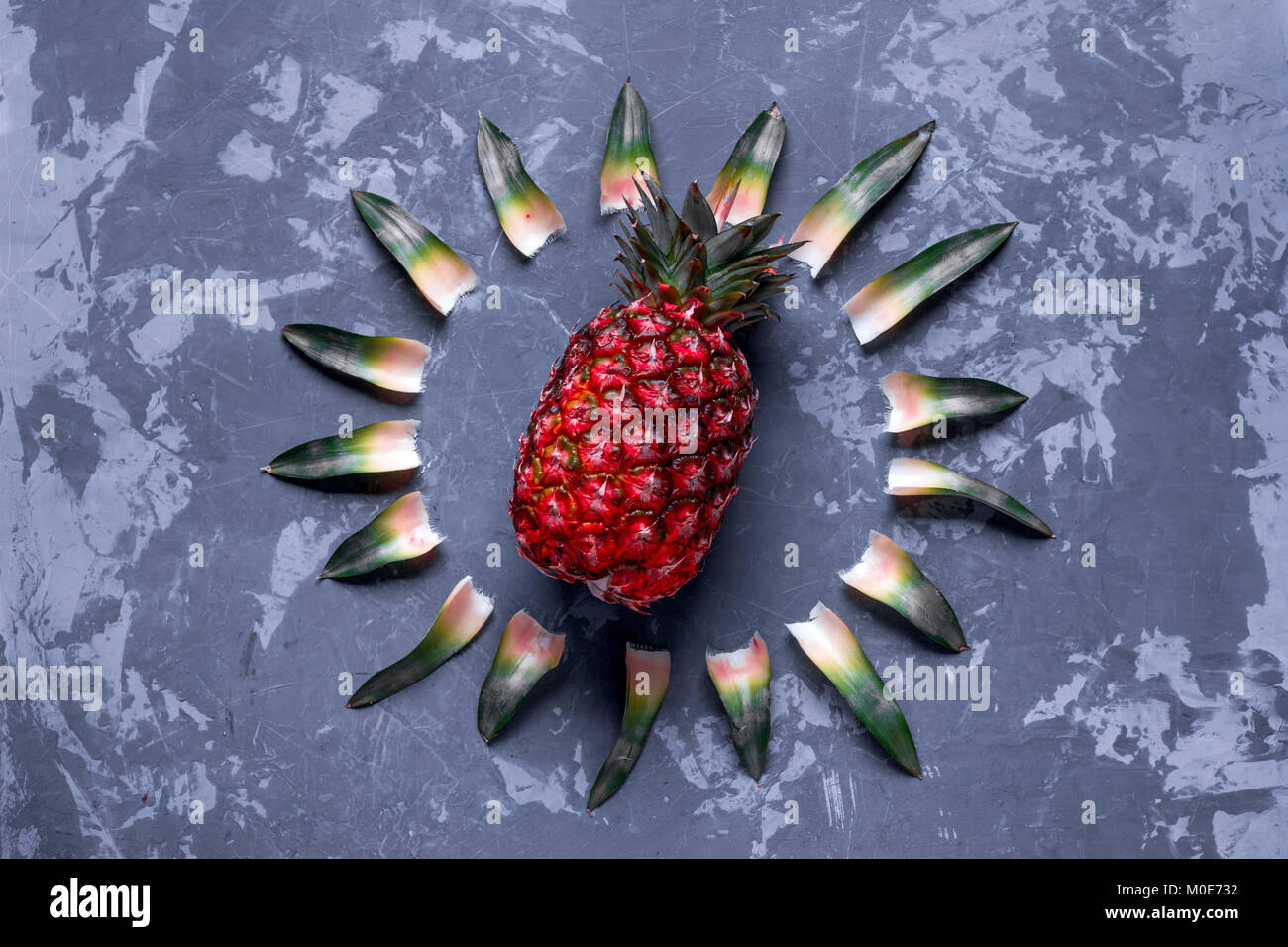Red pineapple on concrete background. Minimal style. Food concept Stock ...