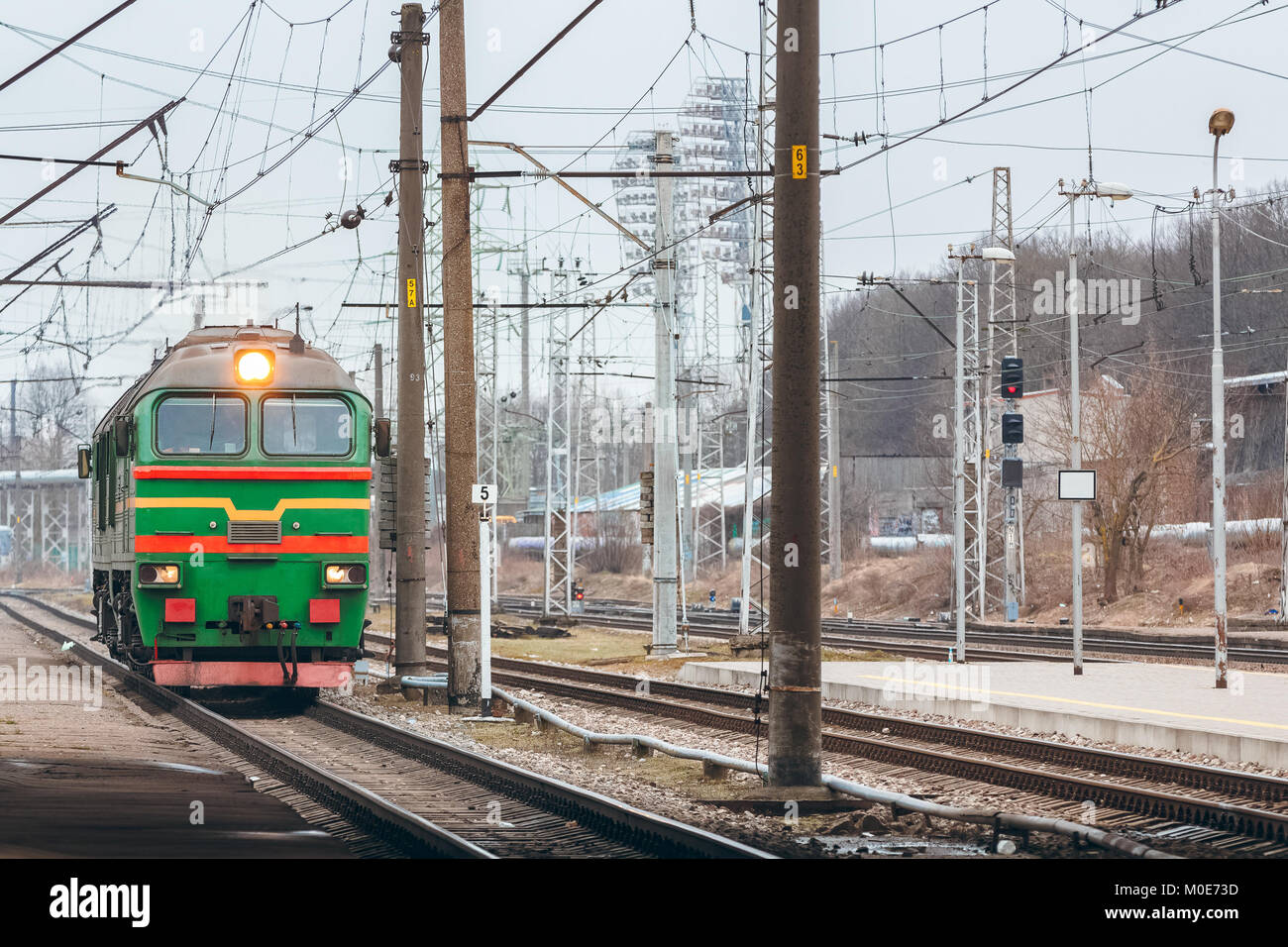 Green diesel cargo locomotive. Freight train in action Stock Photo - Alamy