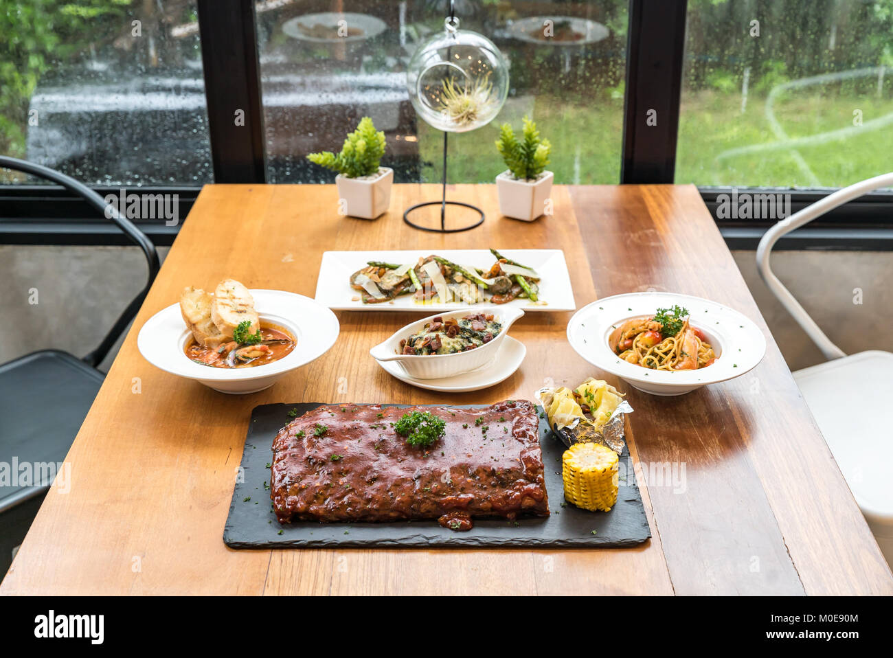 dining table with food ready to eat Stock Photo - Alamy