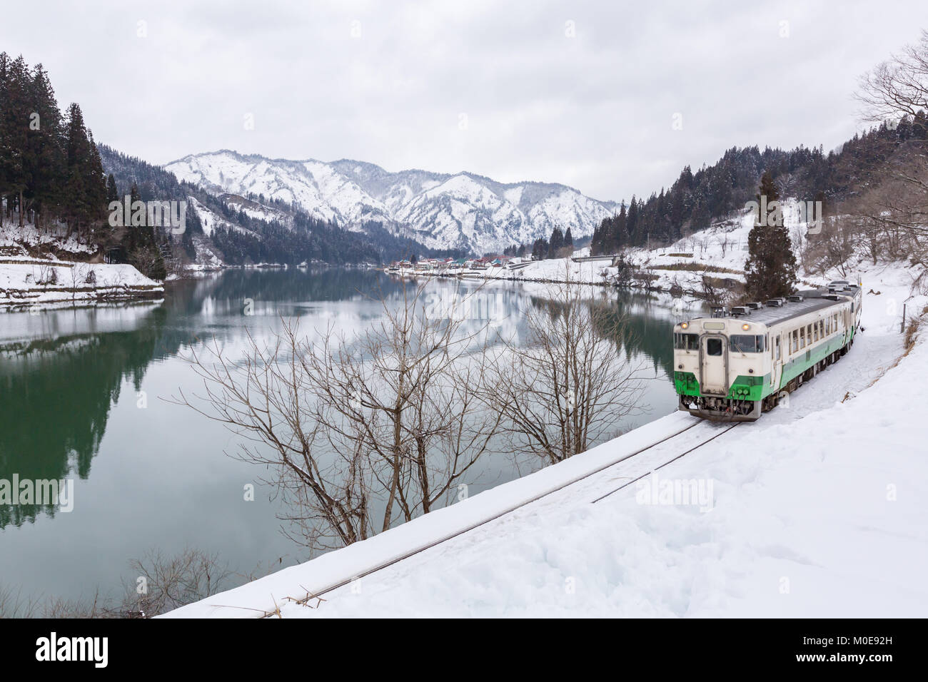 Train in Winter landscape snow on bridge Stock Photo - Alamy