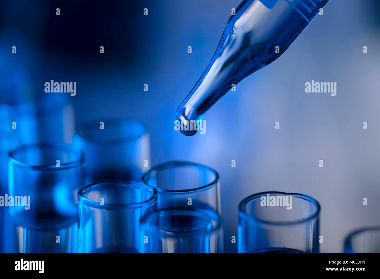 Science concept background. Microscope and laboratory glassware ...