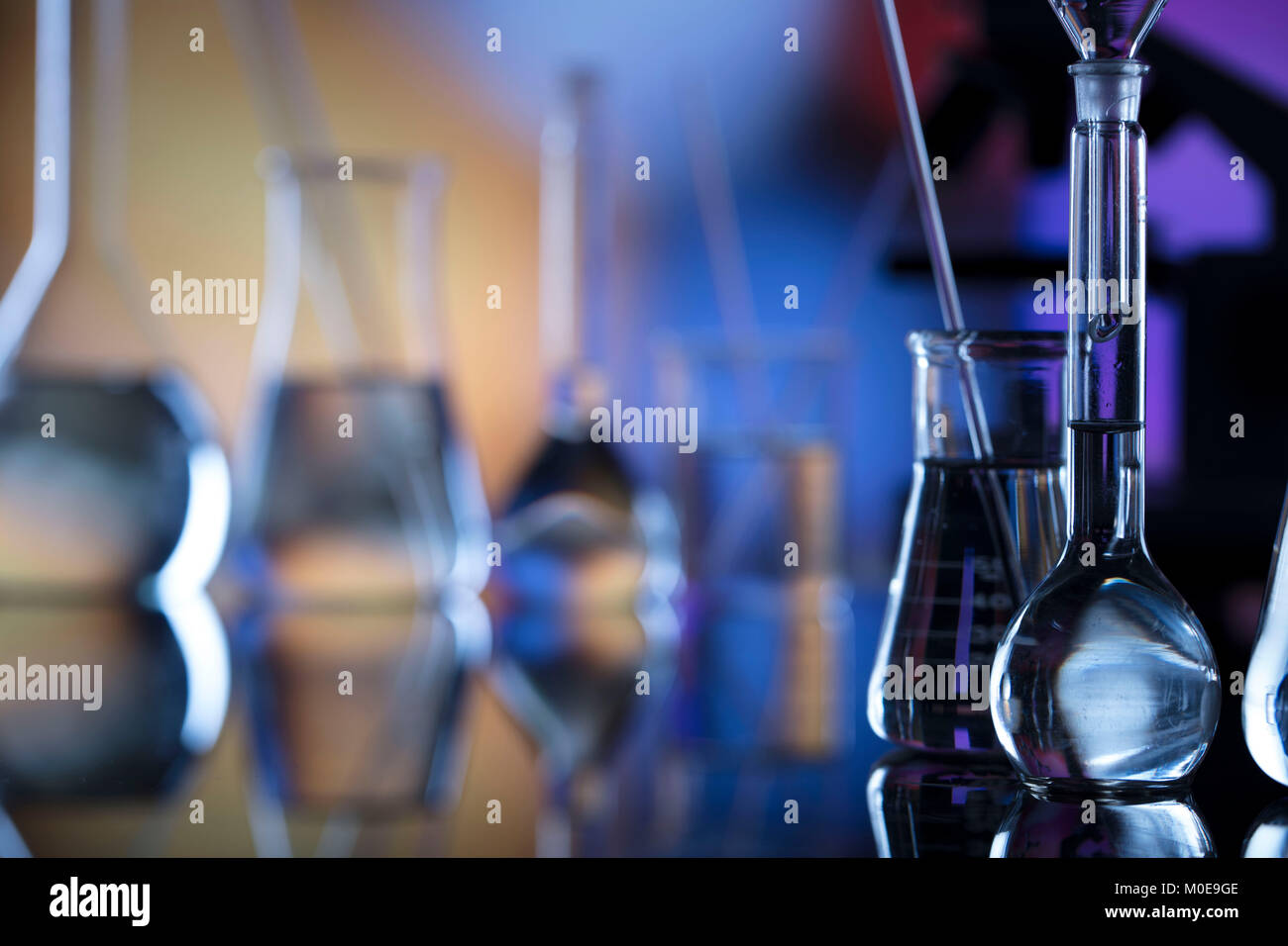 Science concept background. Microscope and laboratory glassware ...