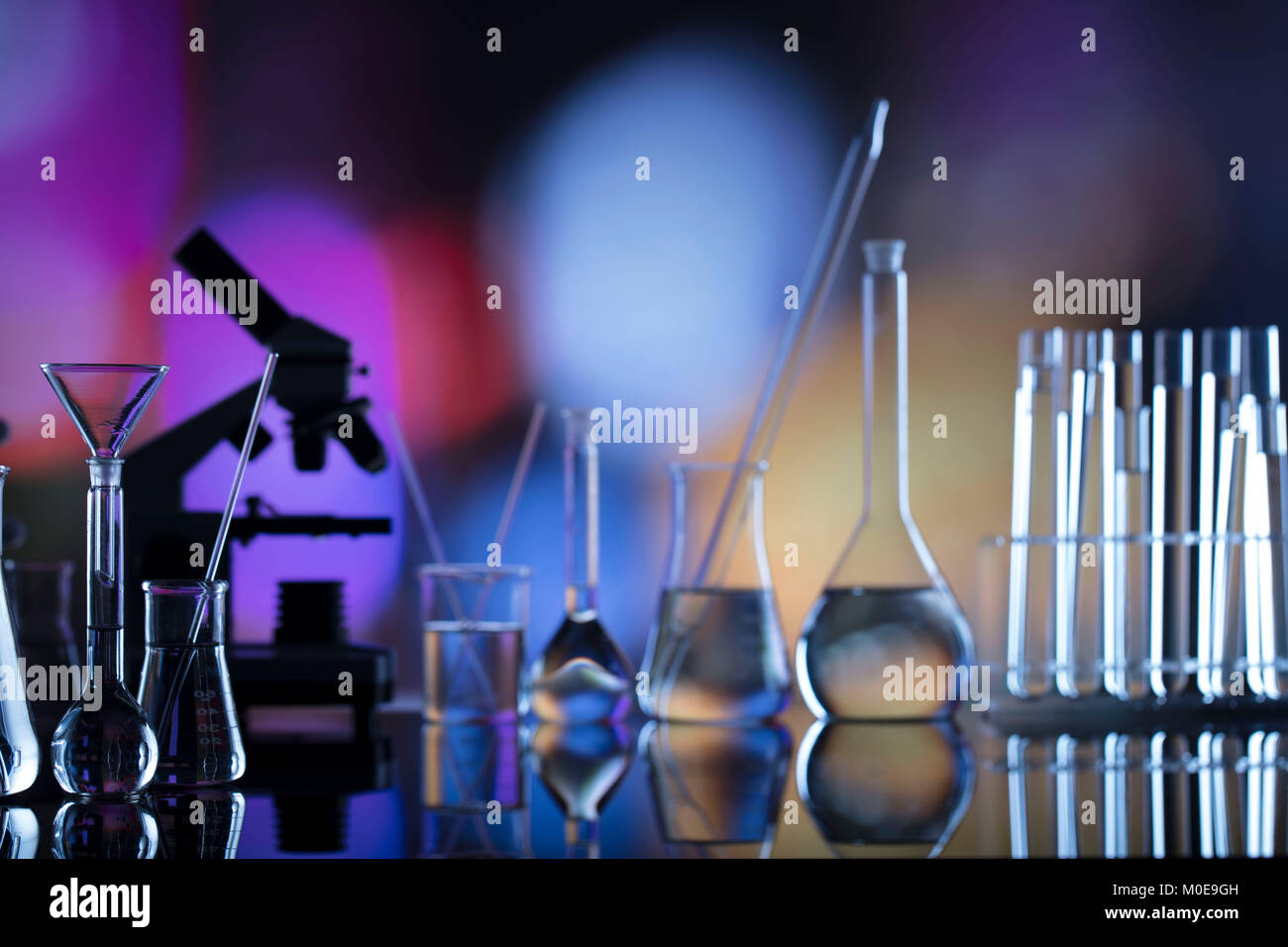 Science concept background. Microscope and laboratory glassware ...