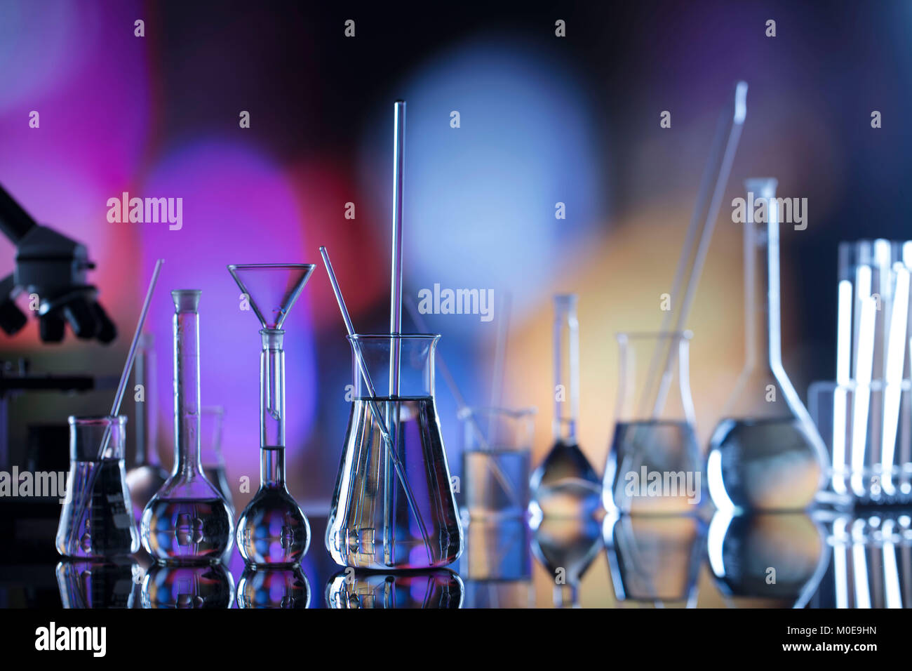 Science concept background. Microscope and laboratory glassware ...