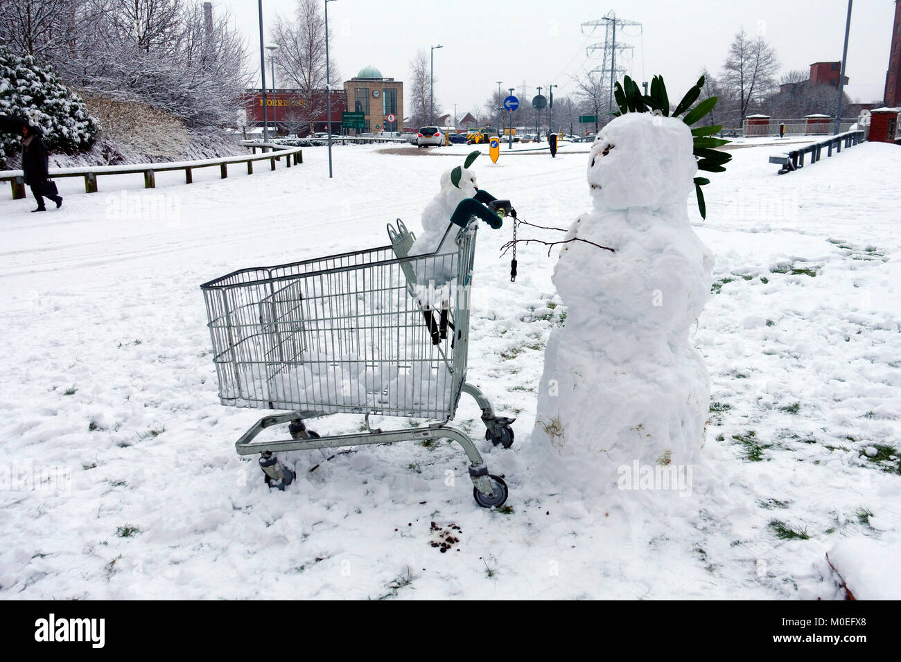 Snowman with snow baby sitting in Supermarket Shopping Trolley Stock ...