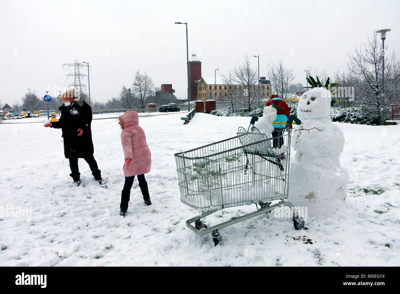 Snowman with snow baby sitting in Supermarket Shopping Trolley Stock ...