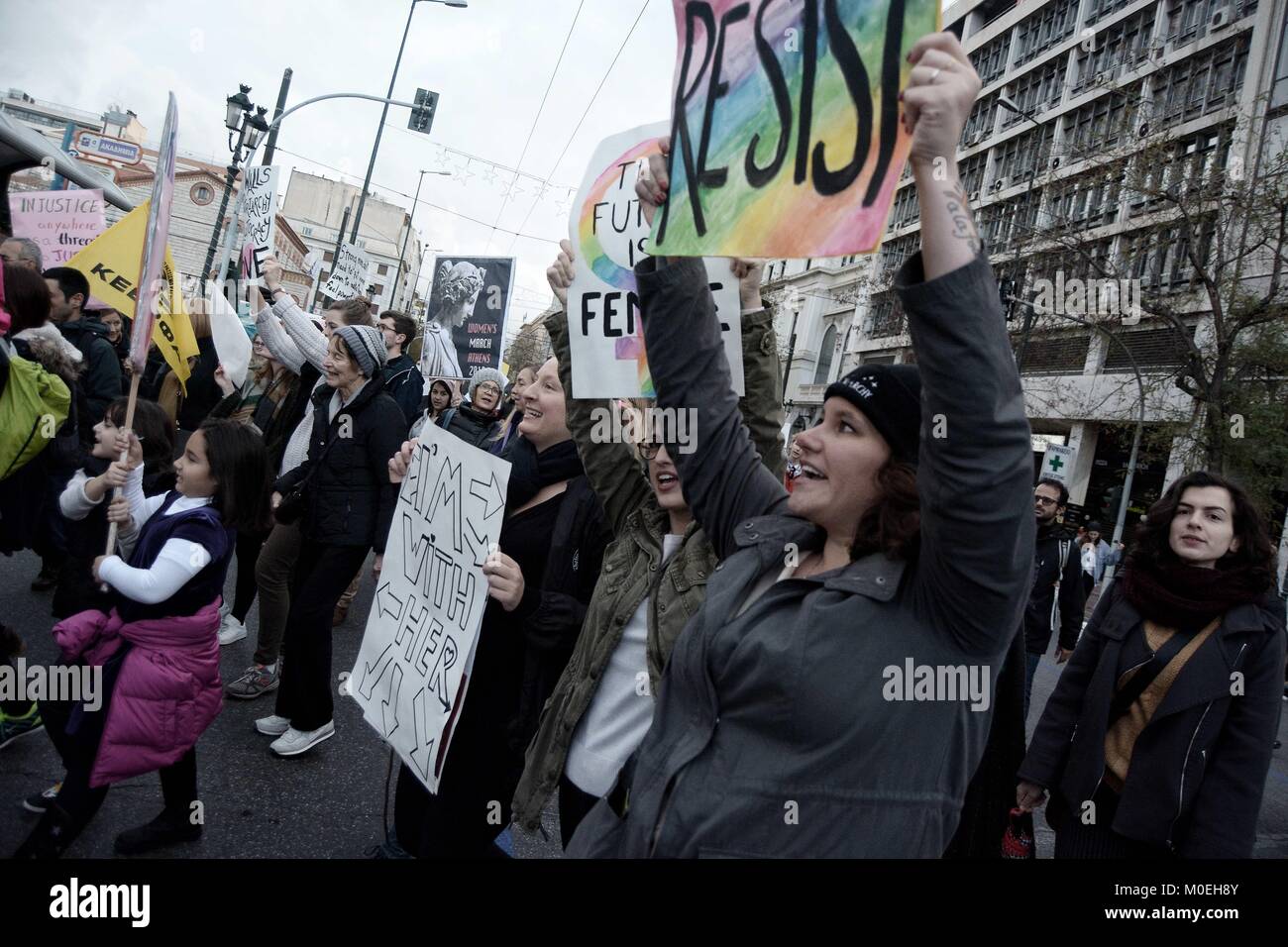 Athens, Greece. 21st Jan, 2018. A woman holds placard during the march ...