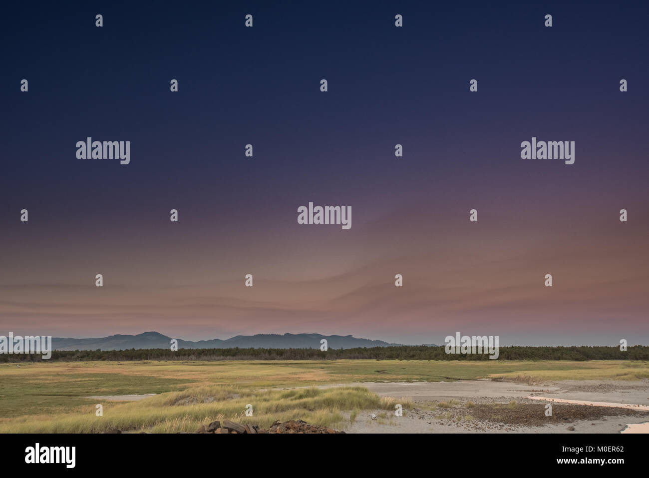 Sunset Over The Columbia River Delta along the border of Oregon and ...