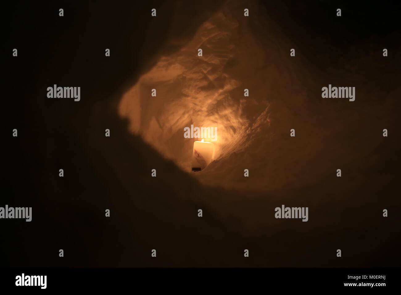 Snowcave Lit With Candles Stock Photo - Alamy