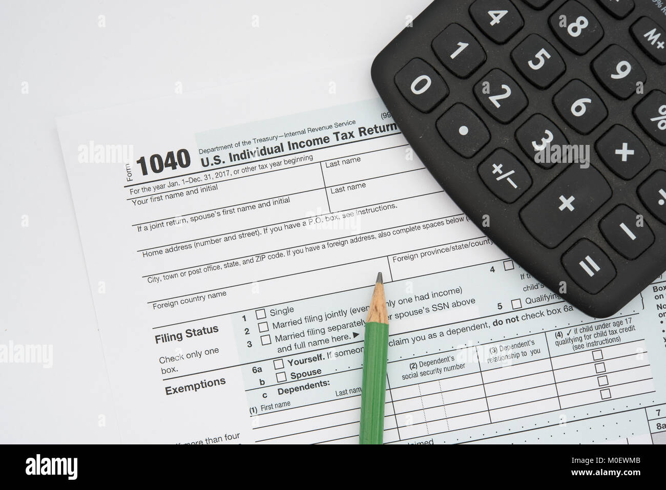 US Federal income tax form 1040 for individuals, with a pencil and a ...