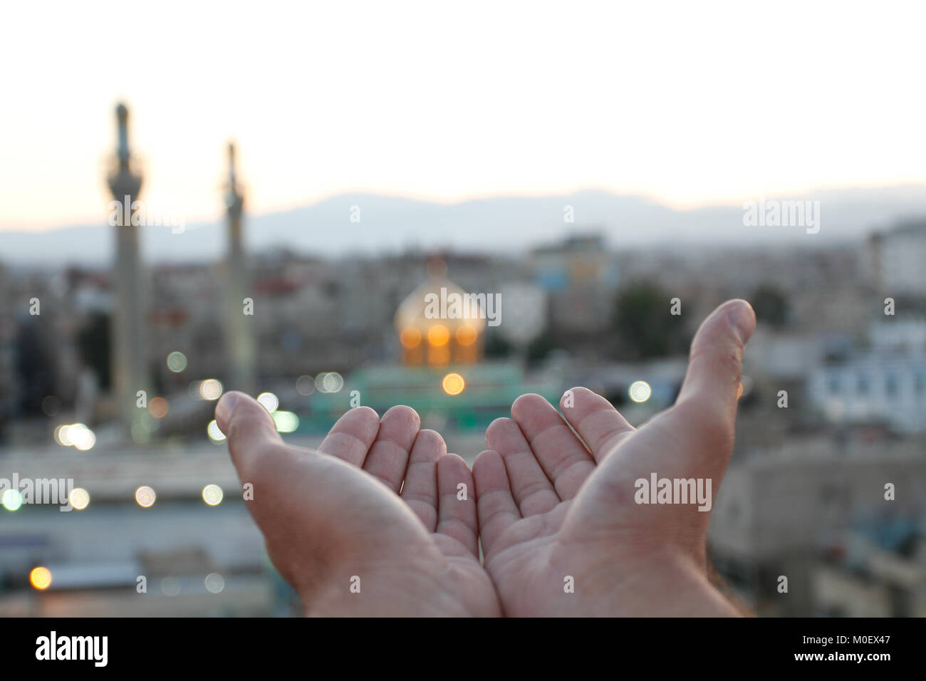 Two of open hands to pray in front of Sayeda Zeinab shrine in Damascus ...
