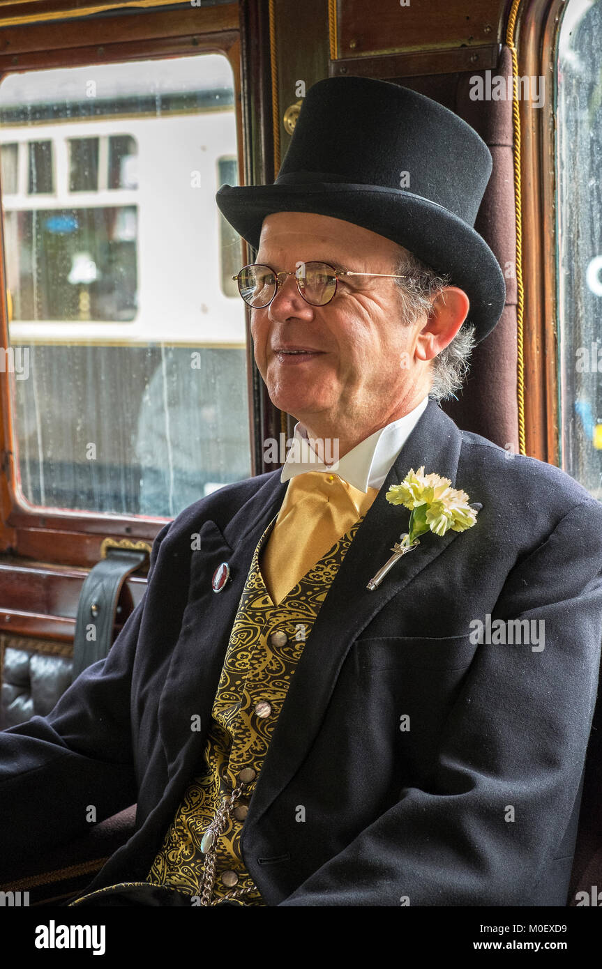 man sitting in a railway carriage dressed in victorian clothing for the ...