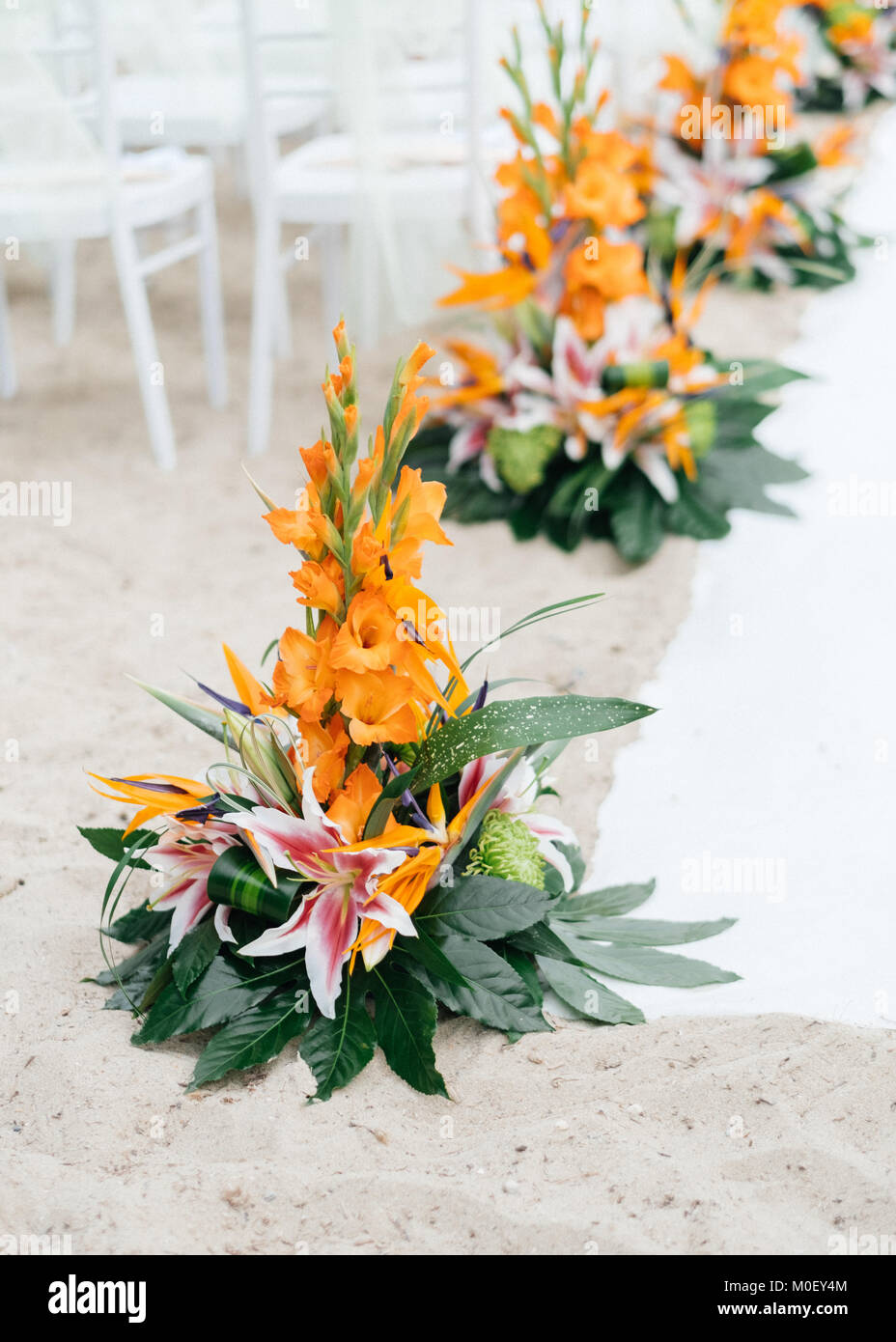 Floral arrangements at a wedding on the beach Stock Photo - Alamy