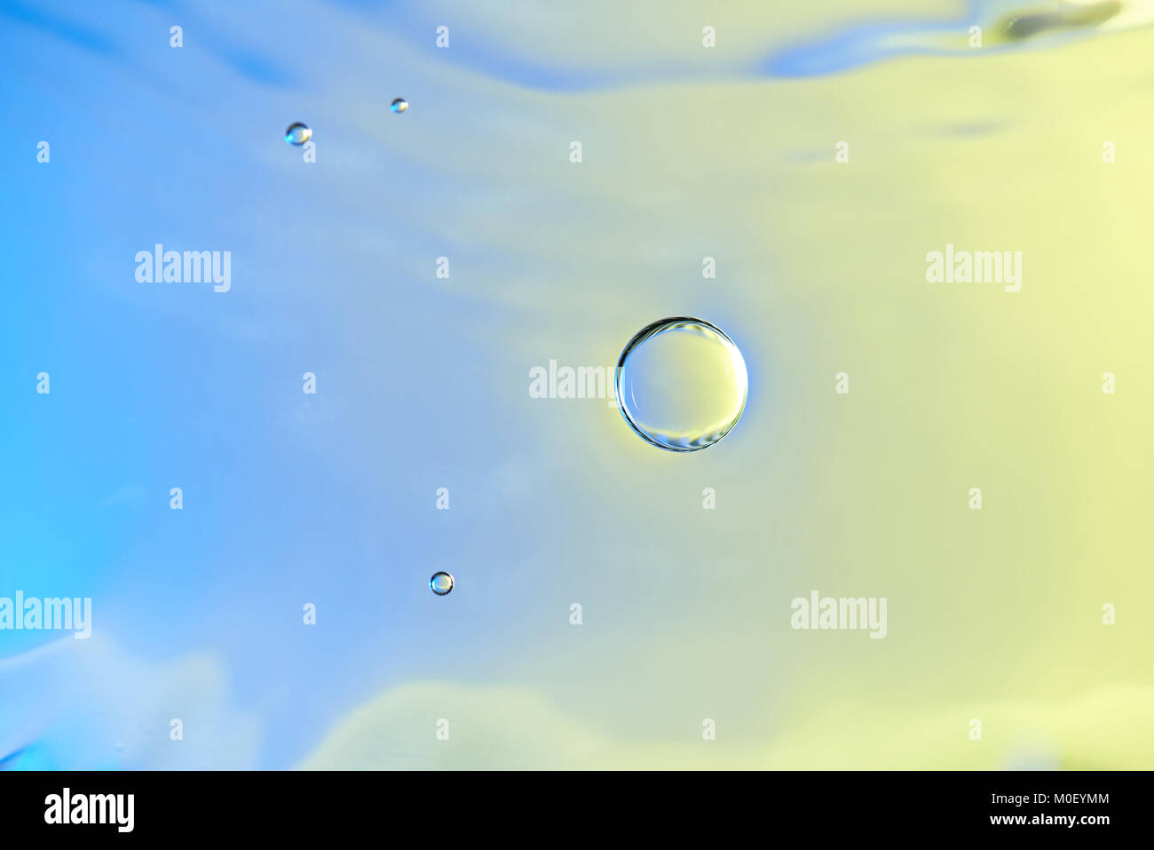 Round air bubble on clean water surface colorful background Stock Photo ...