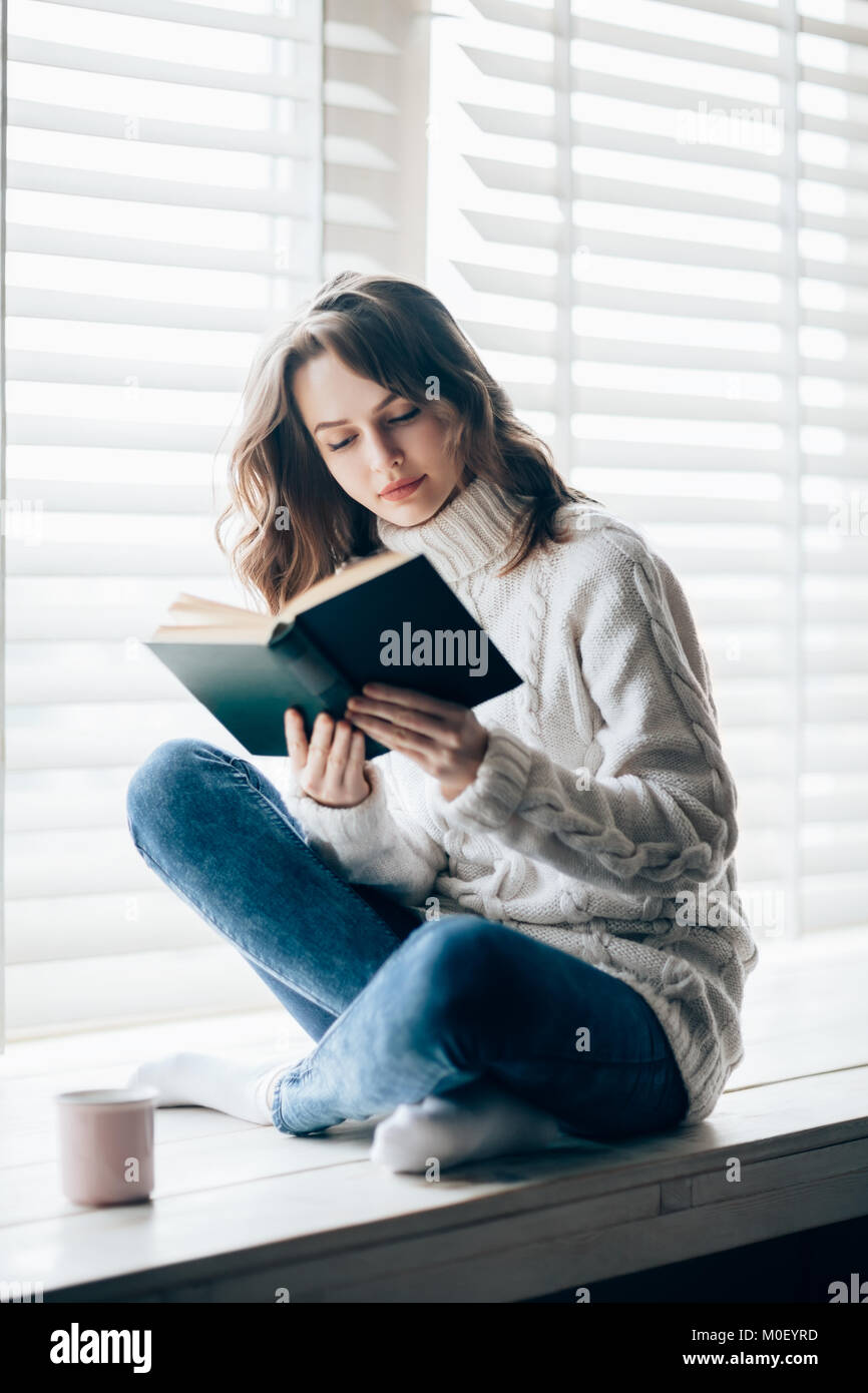 Cozy reading book window hi-res stock photography and images - Alamy