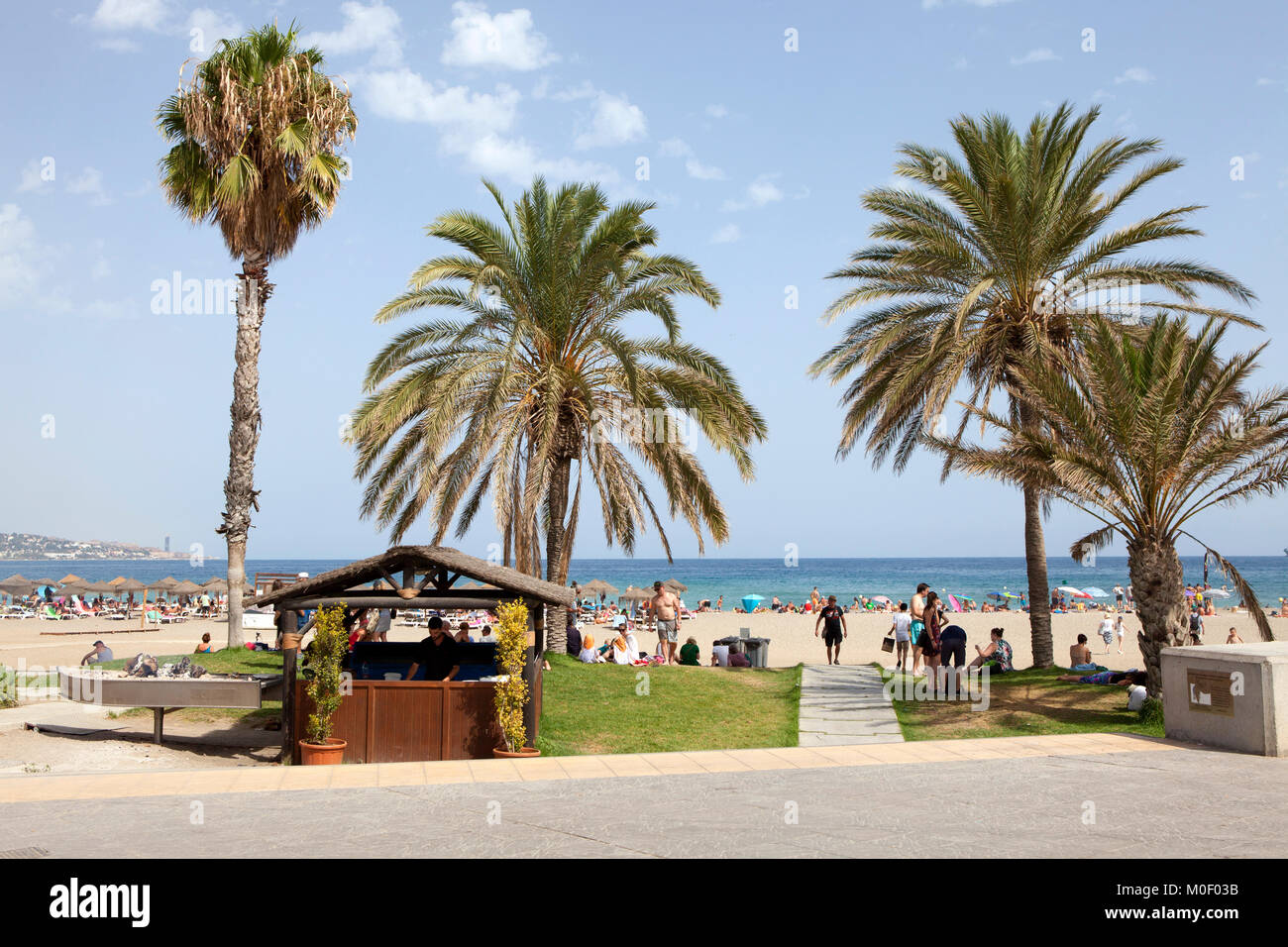 Sunbathers, tourists and locals enjoying the sun, sea and sand at Playa ...