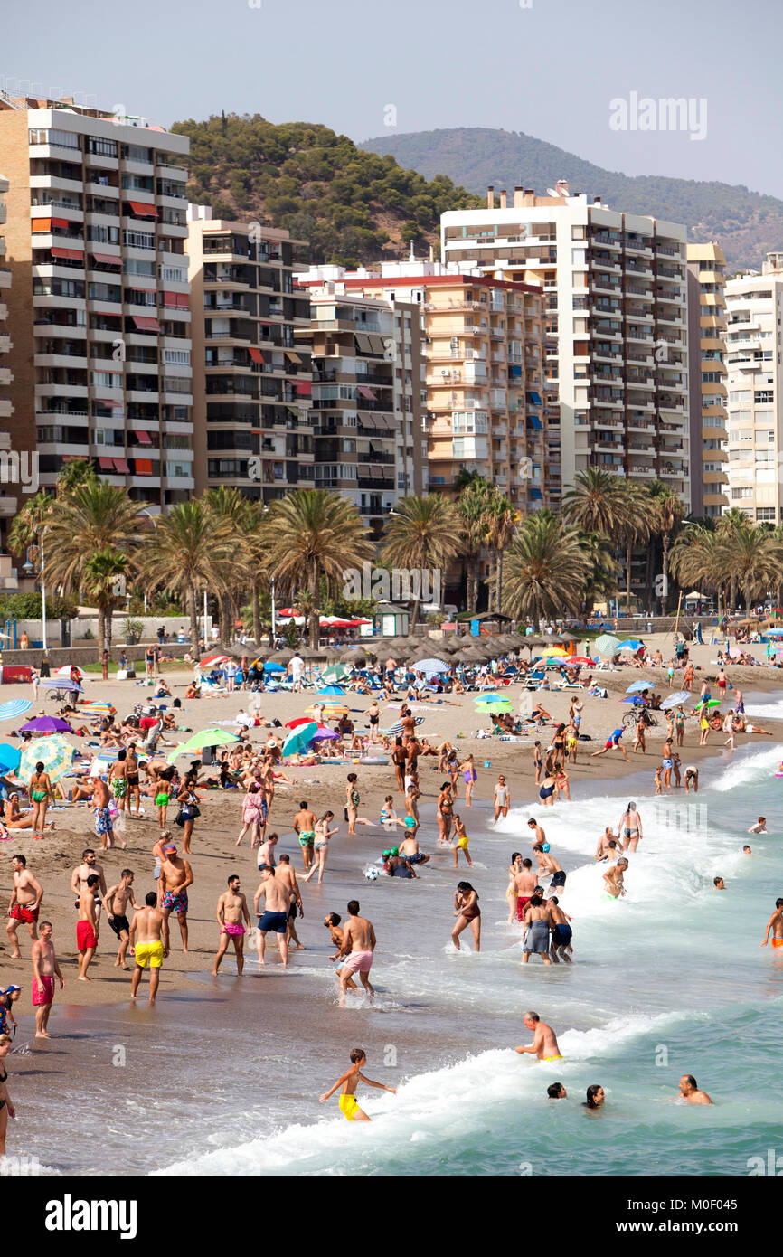 Sunbathers, tourists and locals enjoying the sun, sea and sand at Playa ...