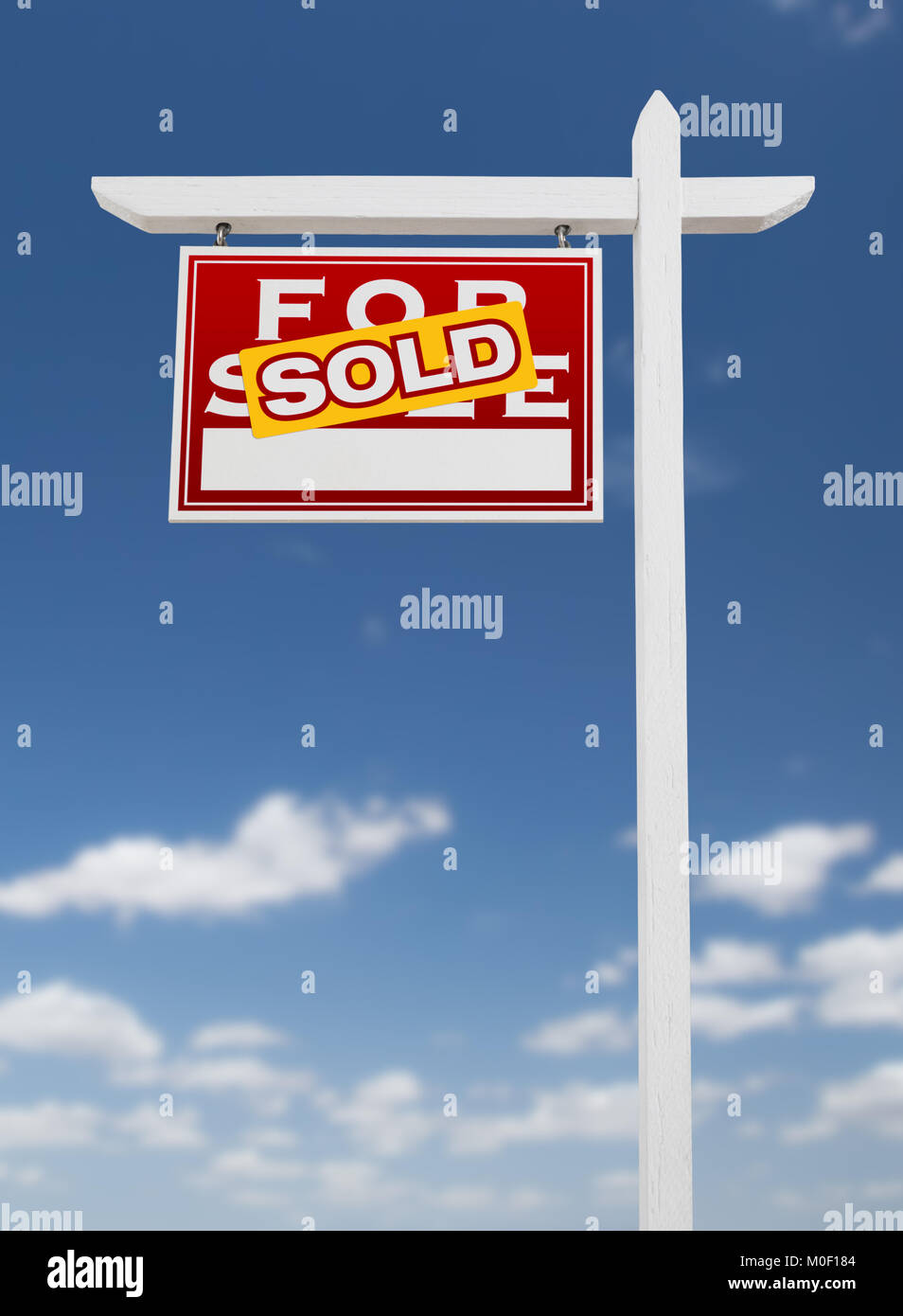 Left Facing Sold For Sale Real Estate Sign on a Blue Sky with Clouds ...