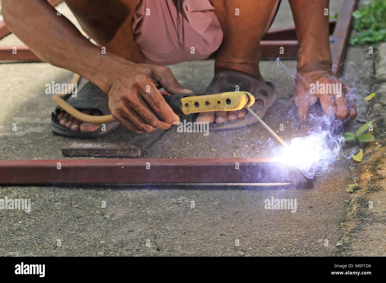 Welders working in Thailand Stock Photo - Alamy