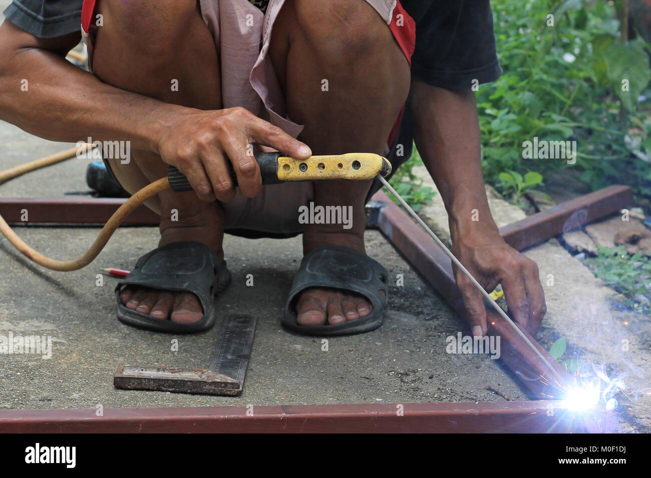 Welders working in Thailand Stock Photo - Alamy