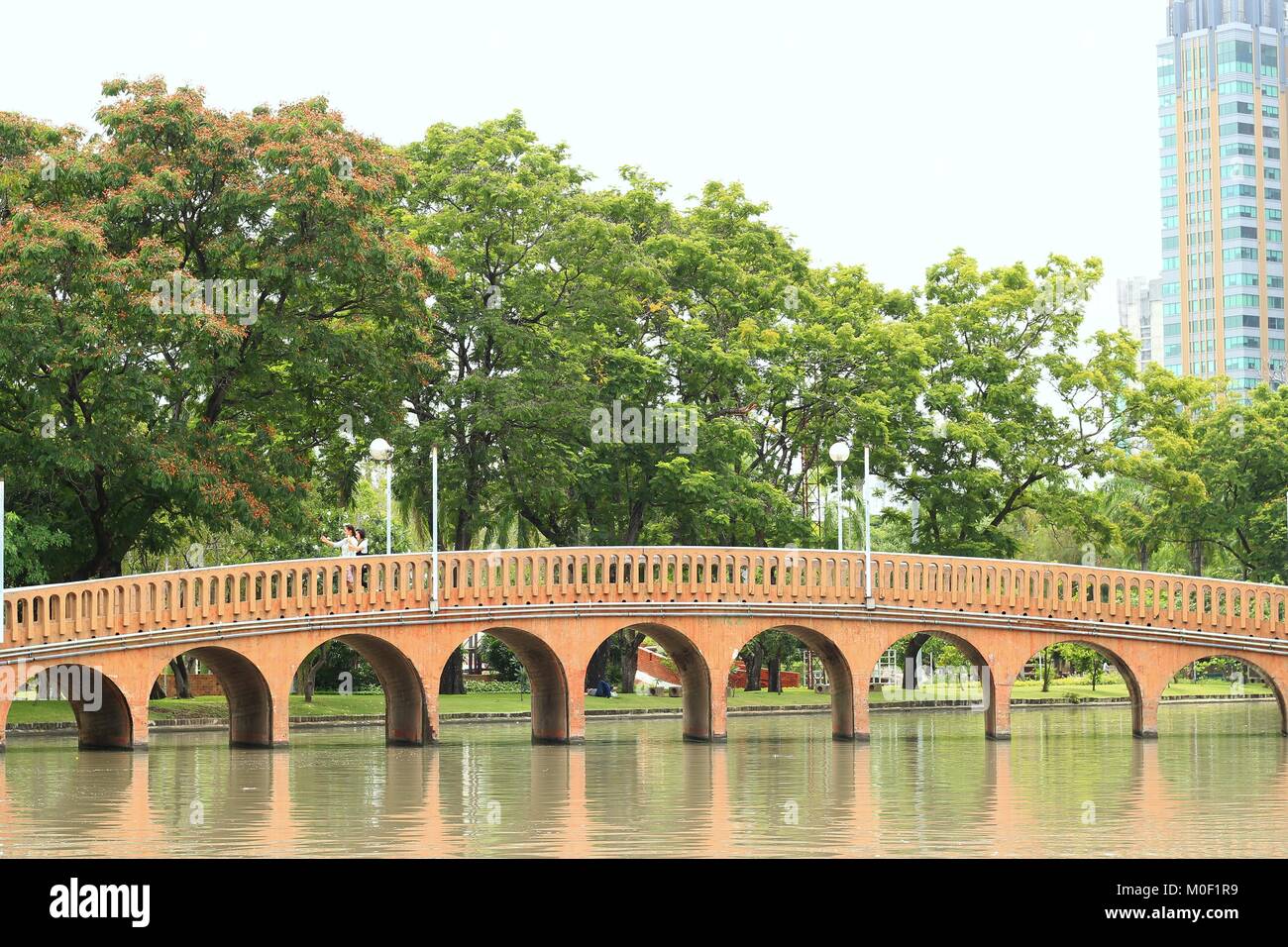Beautiful orange cement bridge in Chatuchak public park Stock Photo - Alamy