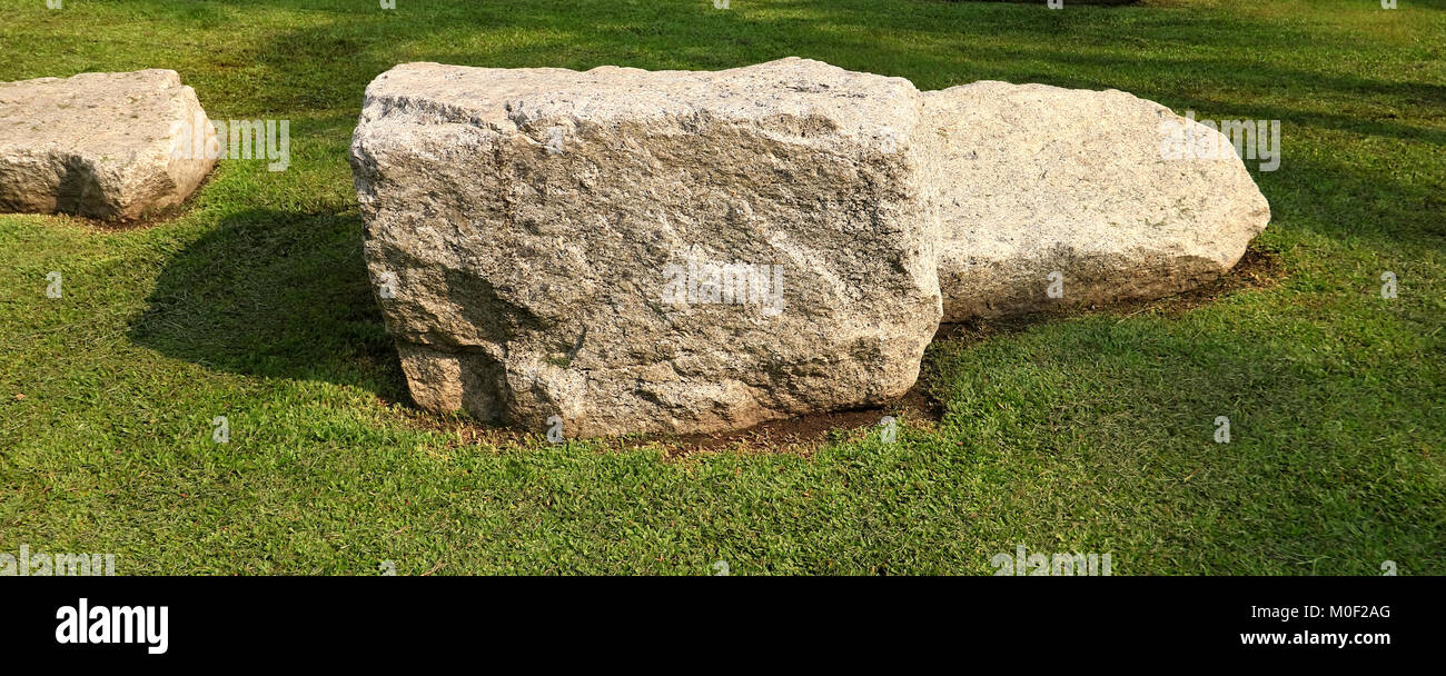 A large stone on grass Stock Photo - Alamy
