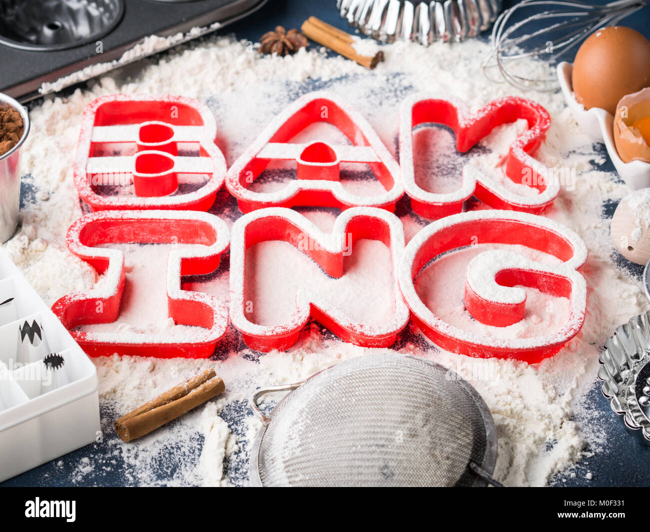 Flour letters spelling Baking with tools and sweet food ingredients ...