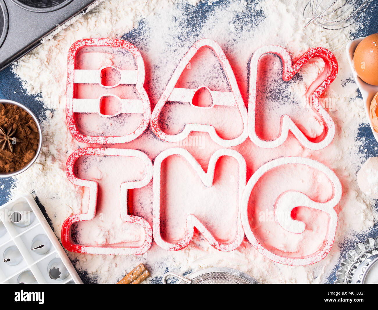 Flour letters spelling Baking with tools and sweet food ingredients ...