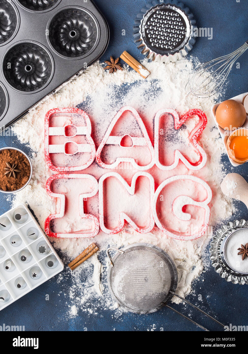 Flour letters spelling Baking with tools and sweet food ingredients ...