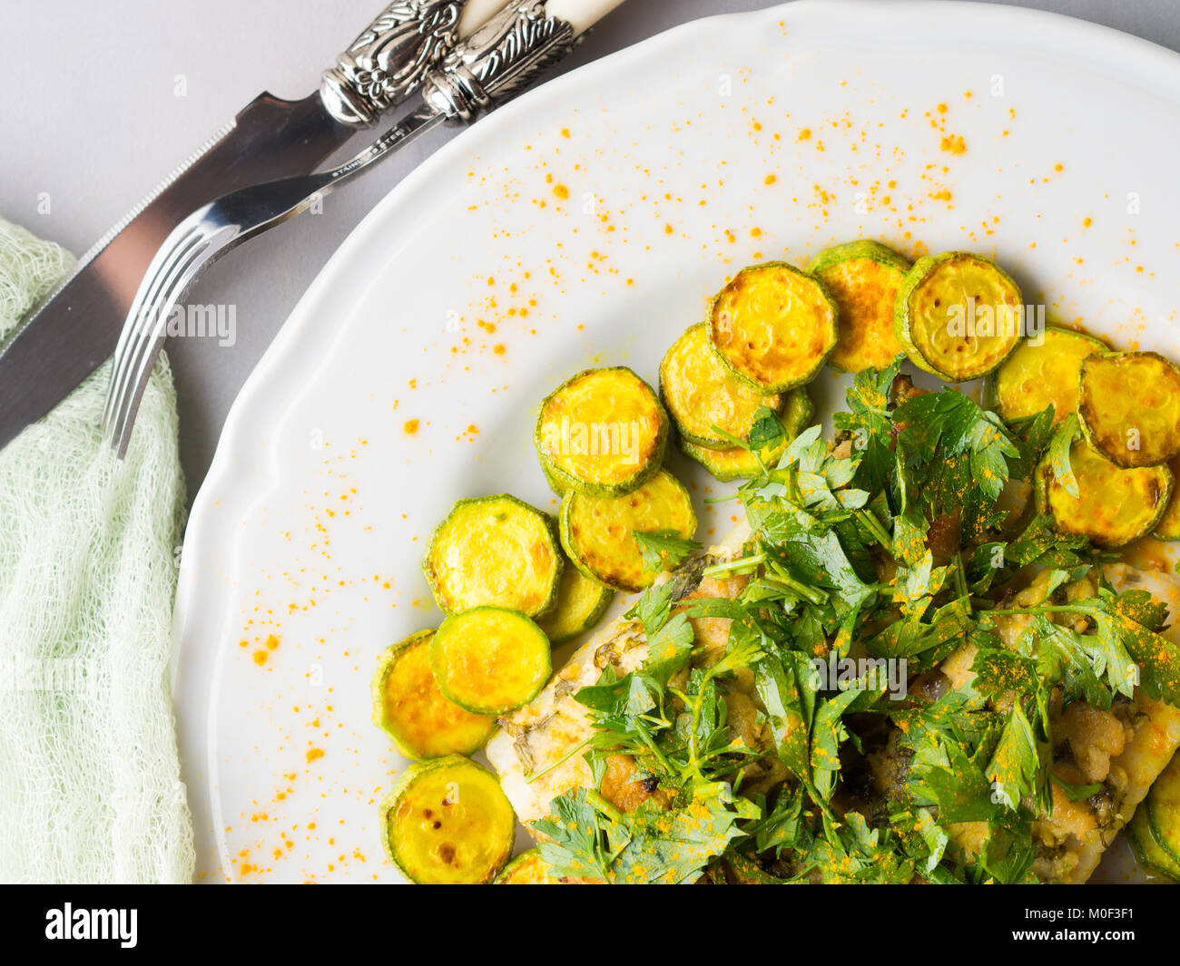 Baked Stock fish fillet with almond parsley topping and turmeric ...