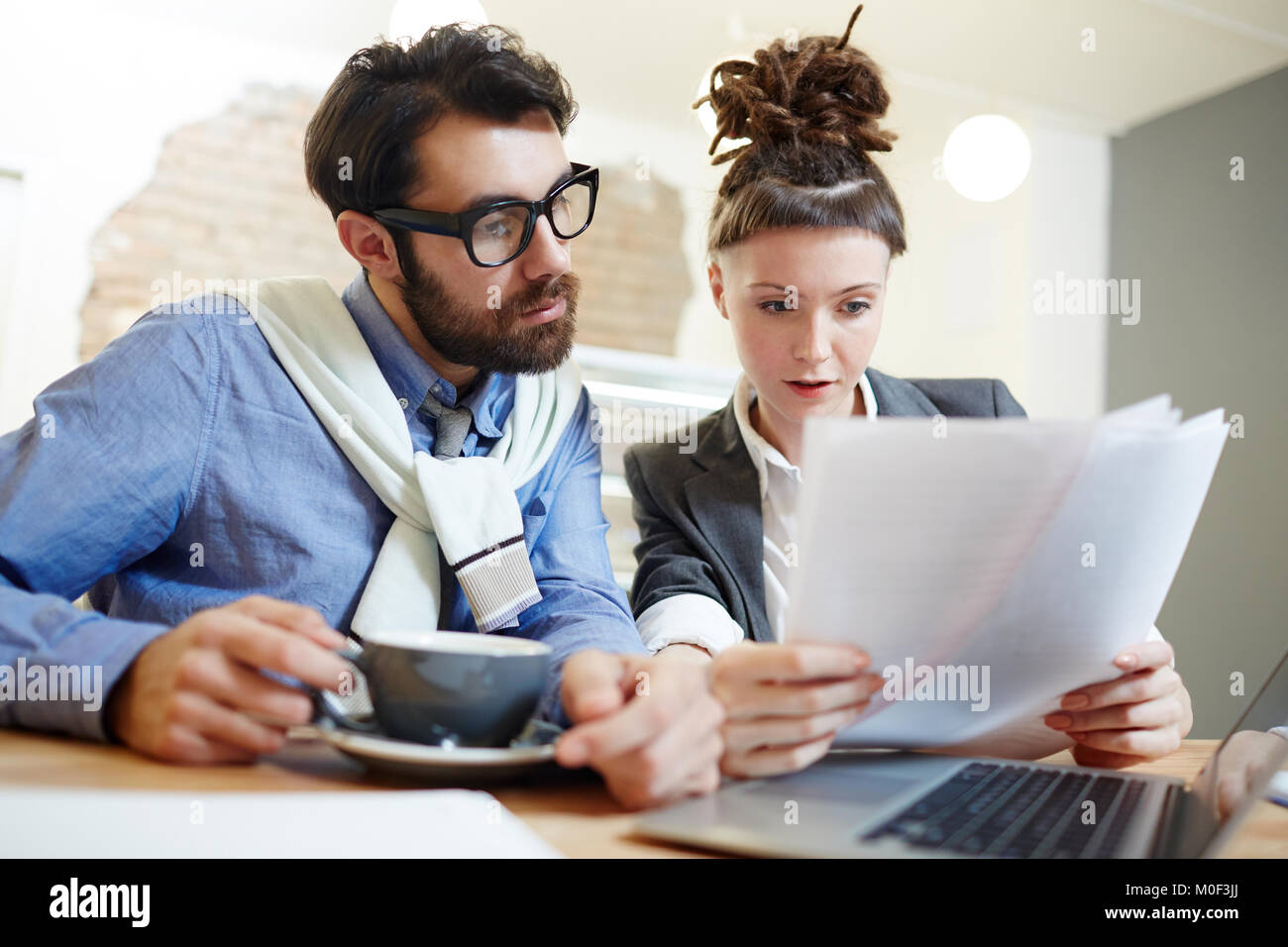 Looking at contract Stock Photo - Alamy