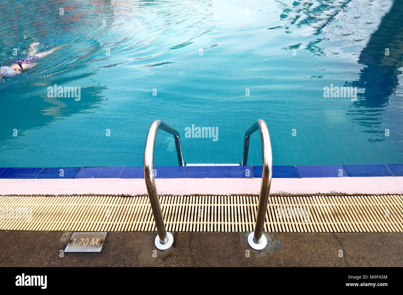 summer vacations concept of swimming pool with blue water in tropical ...