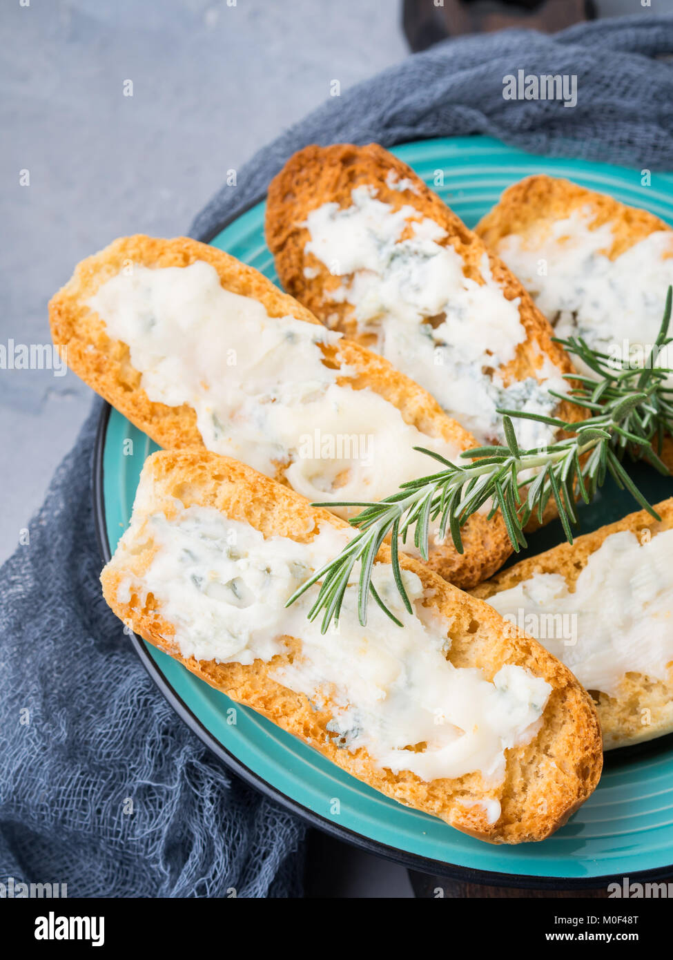 Italian toasts with gorgonzola cheese on rustic background with wine ...