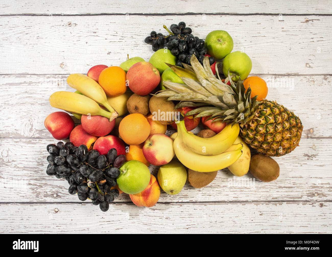 Assortment of exotic fruits on white wooden background Stock Photo - Alamy