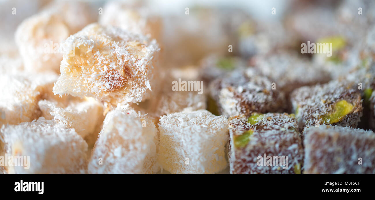 Cube shaped delicious Turkish delight close up background Stock Photo ...