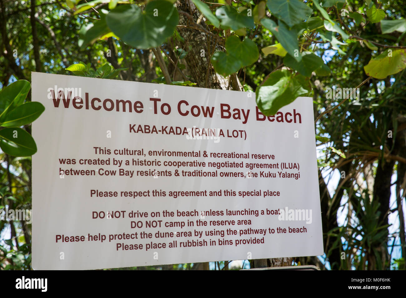 Cow Bay beach on the coast of Far north queensland and a welcome sign ...