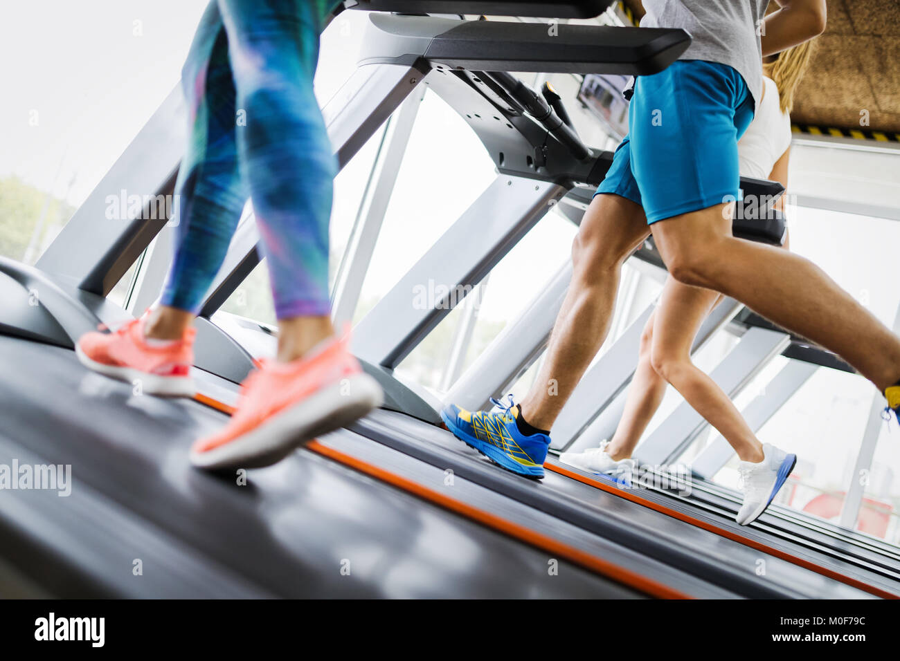 Picture of people running on treadmill in gym Stock Photo - Alamy