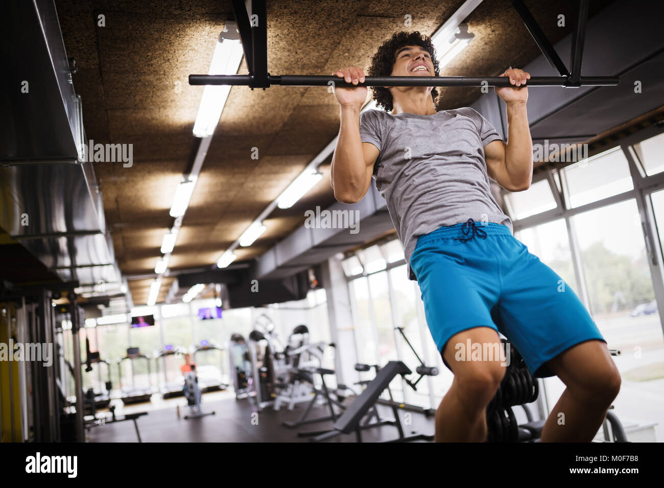 Man working out in gym Stock Photo - Alamy