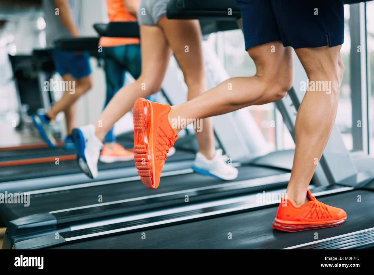 Picture of people running on treadmill in gym Stock Photo - Alamy