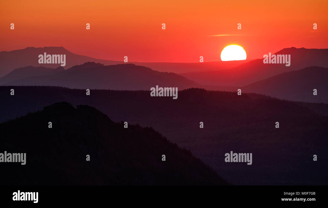 The rising sun over the folds of South Ural mountains, Russia Stock ...