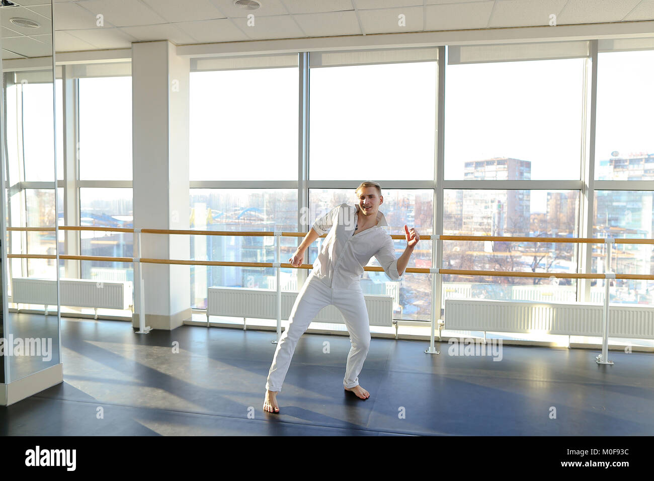 Guy making somersault backwards at studio Stock Photo - Alamy