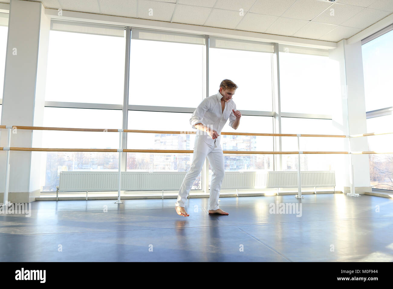 Male dancer moves using street style elements Stock Photo - Alamy