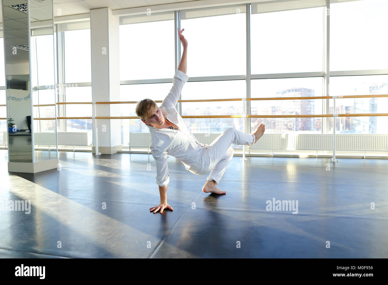 Male dancer moves using street style elements Stock Photo - Alamy