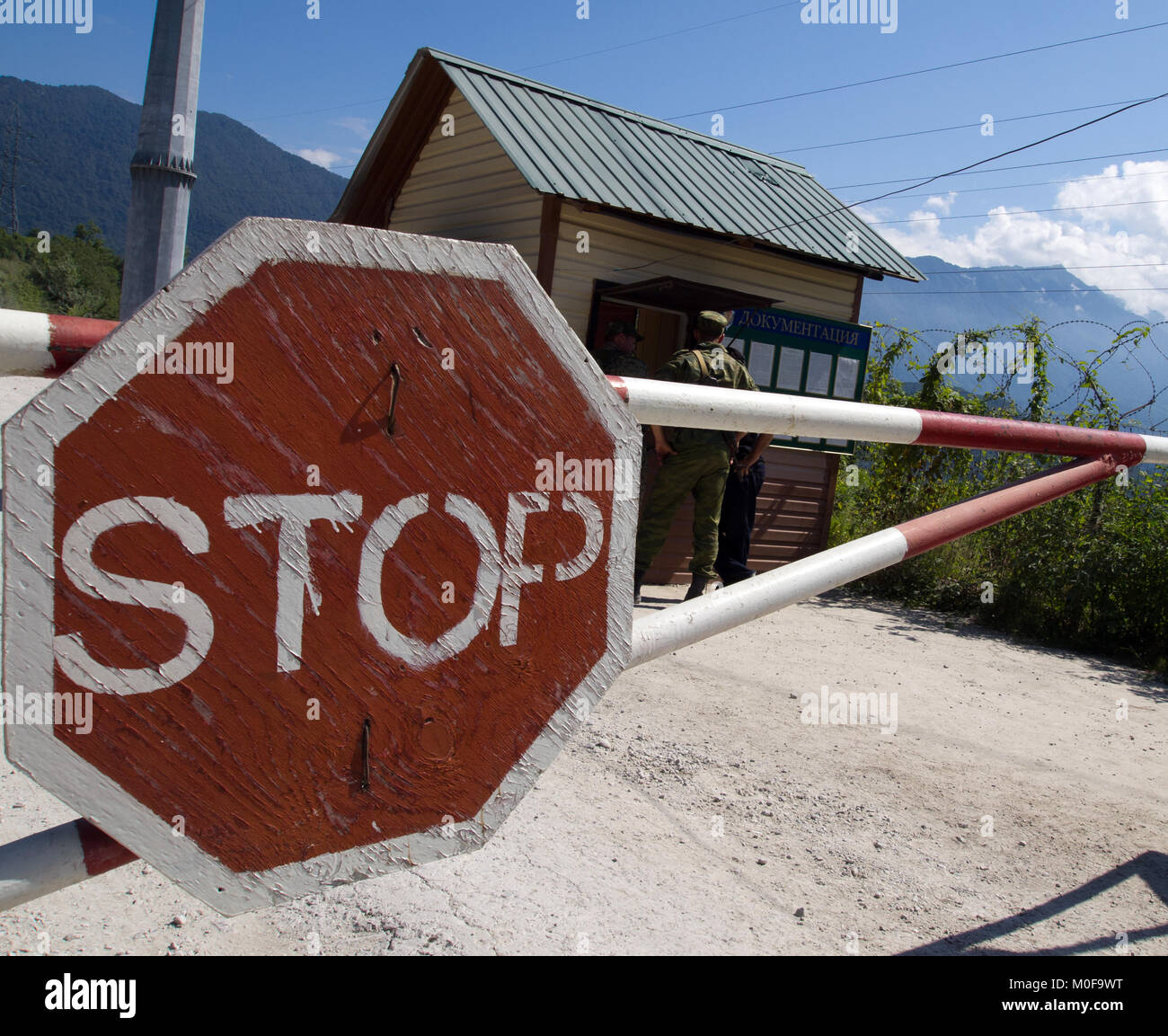 Stop sign at security checkpoint Stock Photo - Alamy